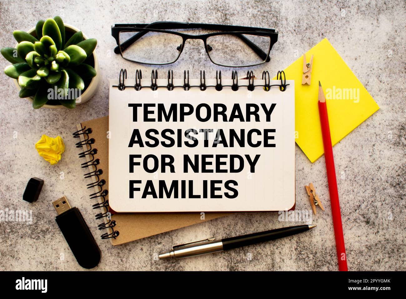 Temporary Assistance for Needy Families TANF is shown on a photo using ...