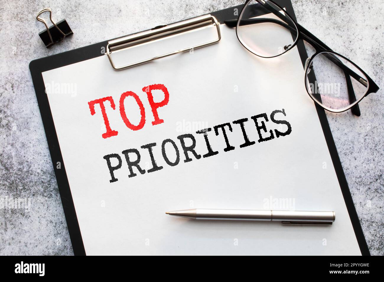 Top Priority text circled in pencil on textured paper Stock Photo - Alamy