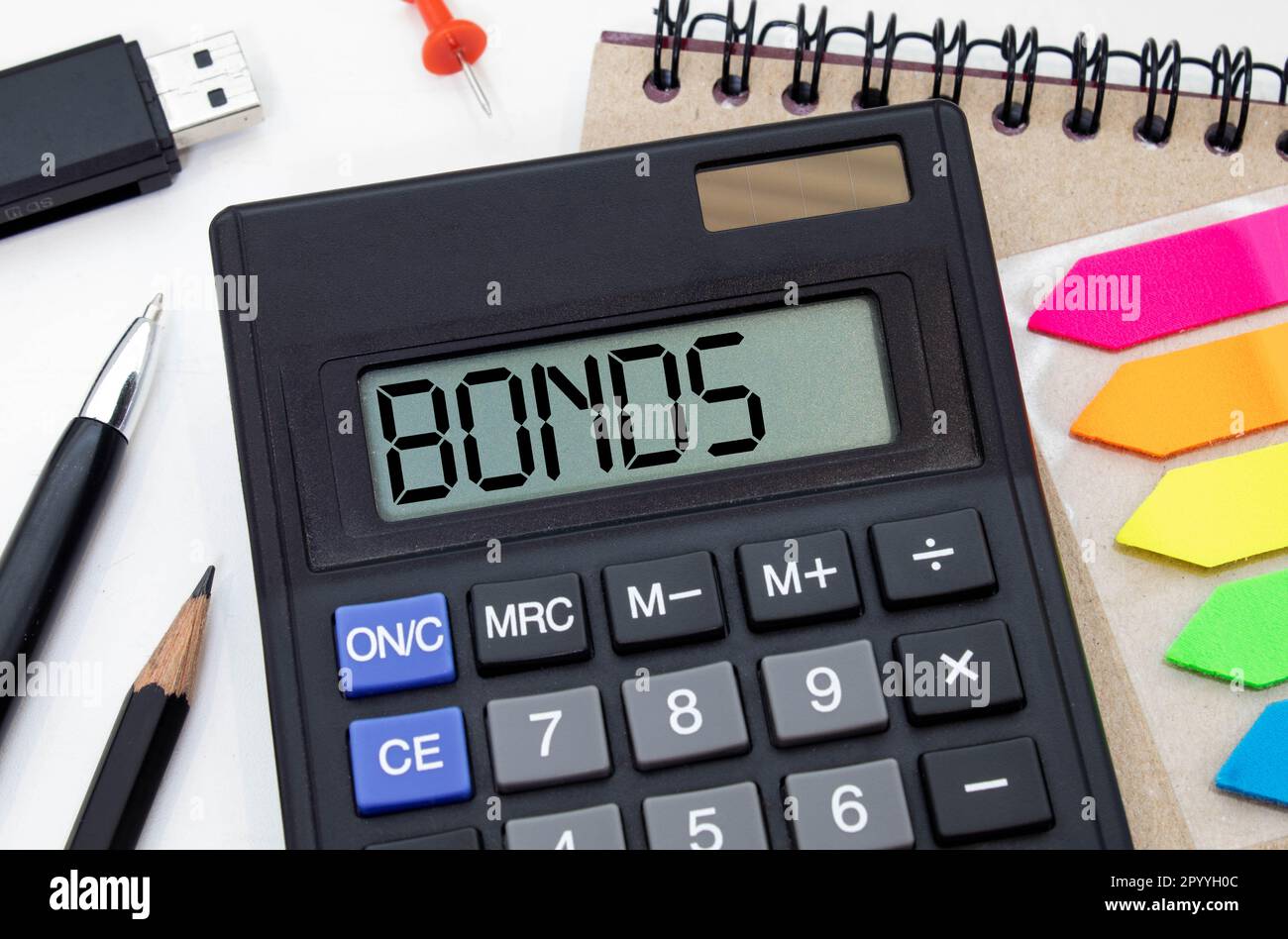 Word BONDS in wooden block on US Dollar bills Stock Photo - Alamy