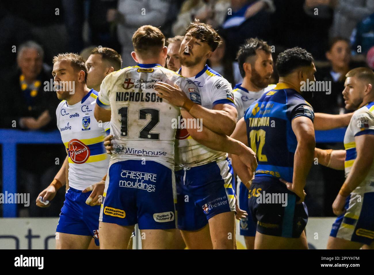 Matty Ashton #5 of Warrington Wolves celebrates his try during the ...