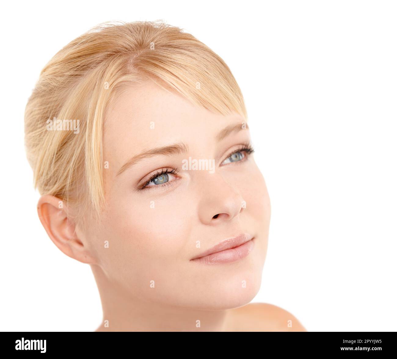 Beautiful and feminine. Studio shot of a beautiful young woman with ...