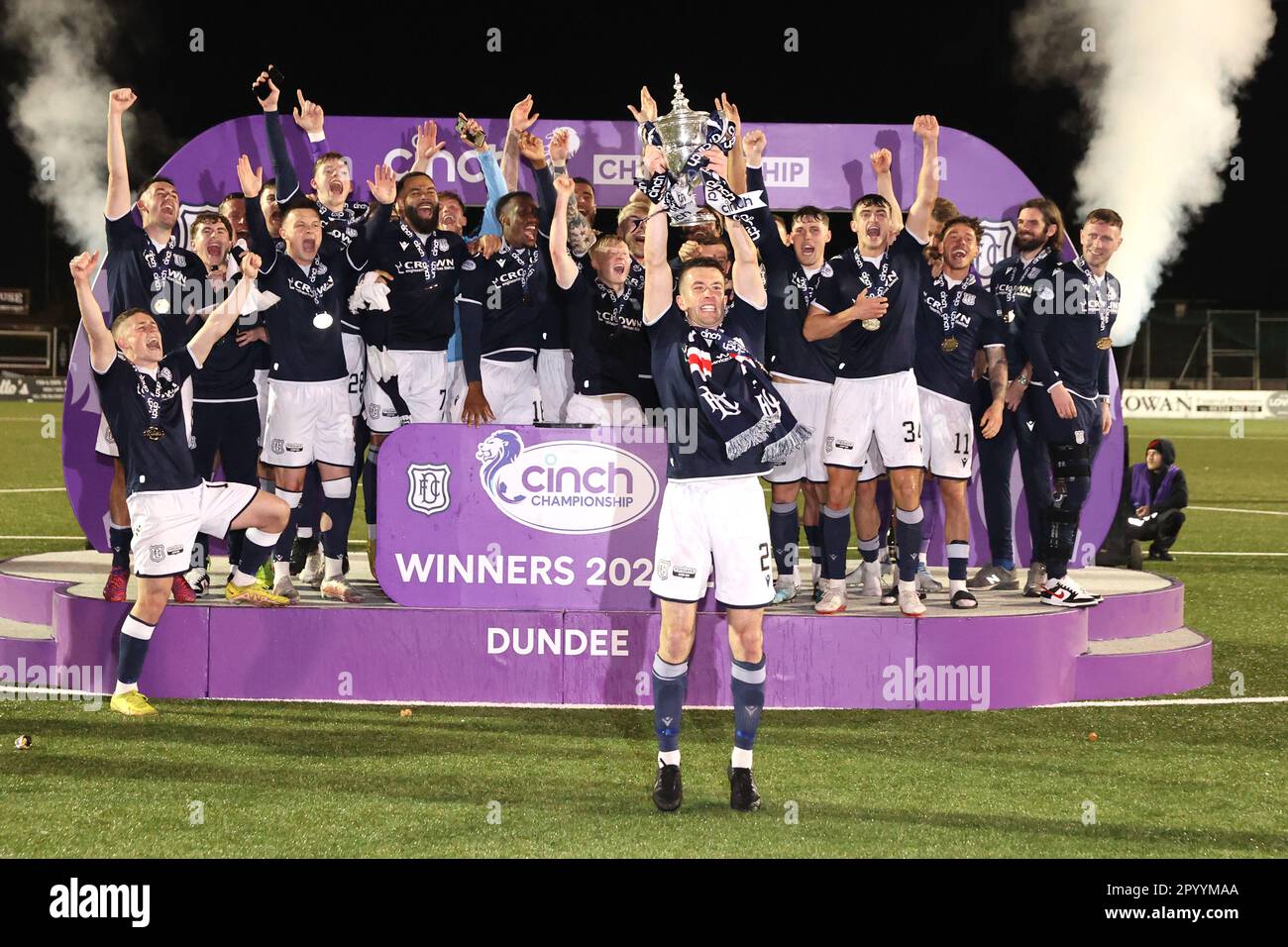 Dundee's Cammy Kerr celebrates lifting the trophy with team-mates after ...