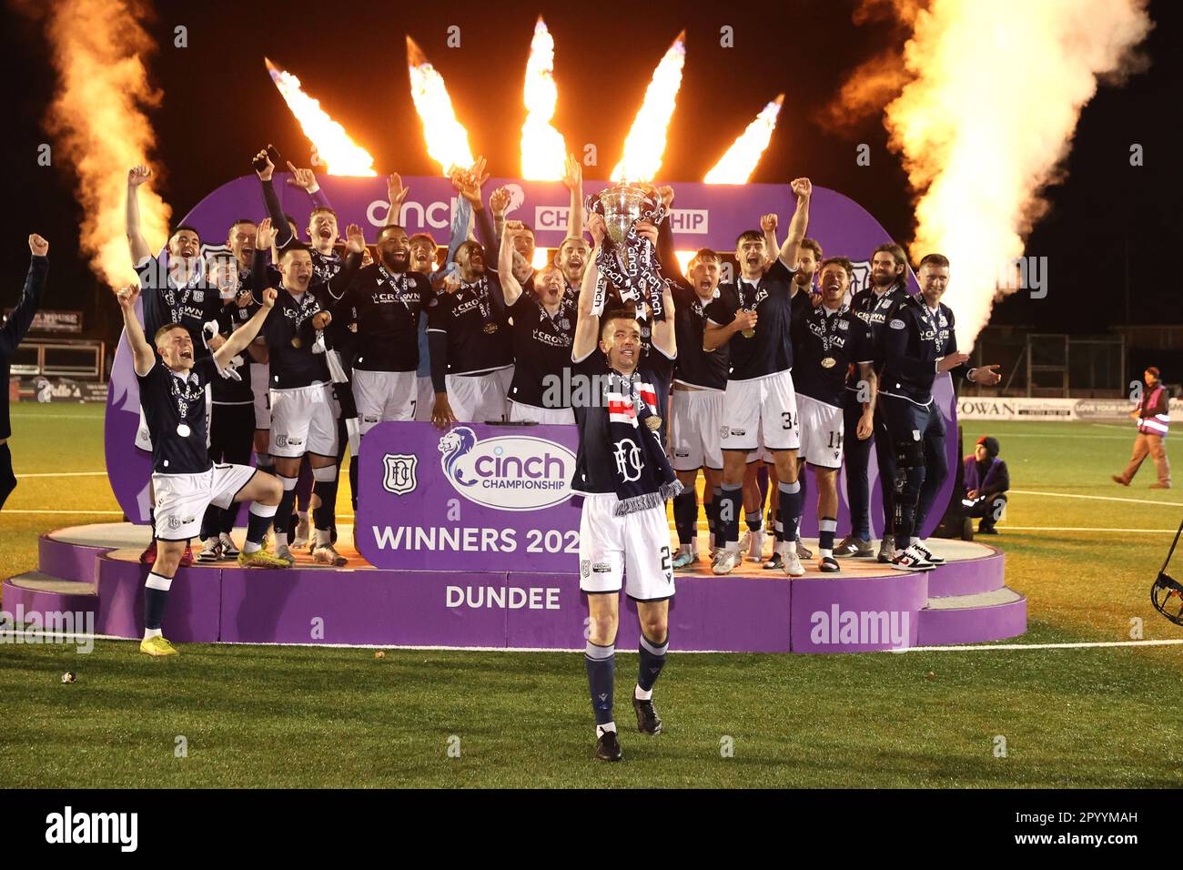 Dundee's Cammy Kerr celebrates lifting the trophy with team-mates after ...