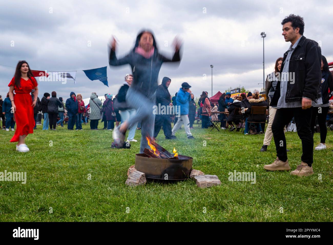 Fatih, Istanbul, Turkey. 5th May, 2023. A woman jumps over the fire ...