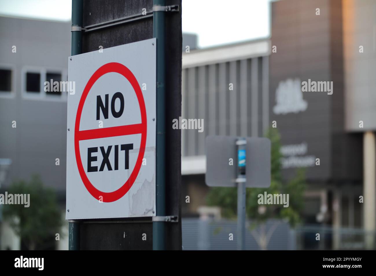 A no-exit sign taped to a metal pole Stock Photo - Alamy