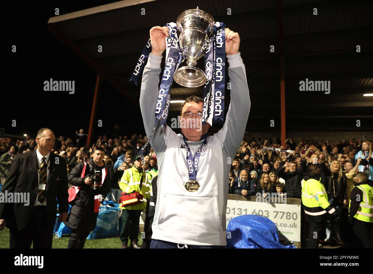 Dundee manaer Gary Bowyer celebrates with the trophy after winning the ...