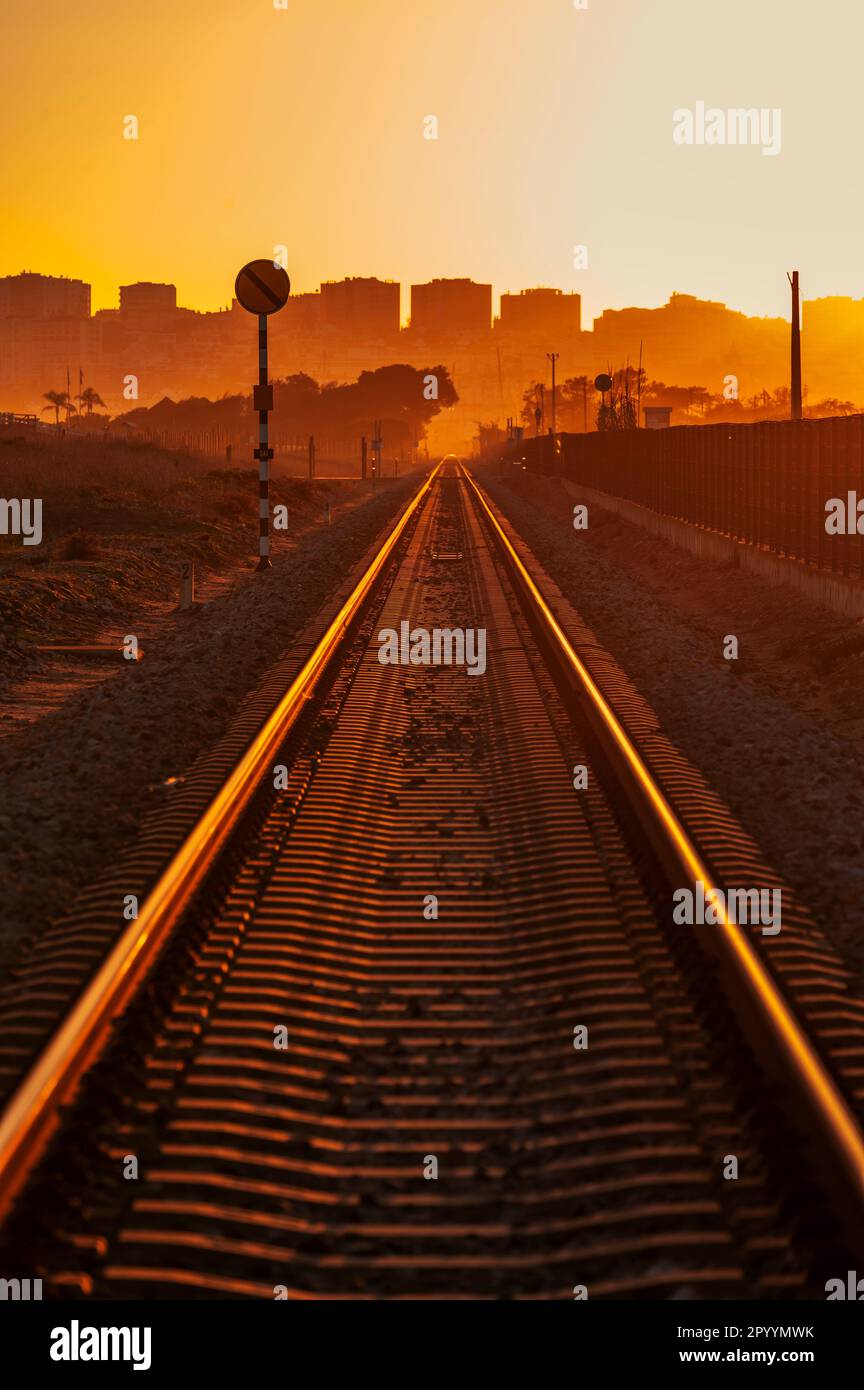 An empty railroad at sunset Stock Photo - Alamy