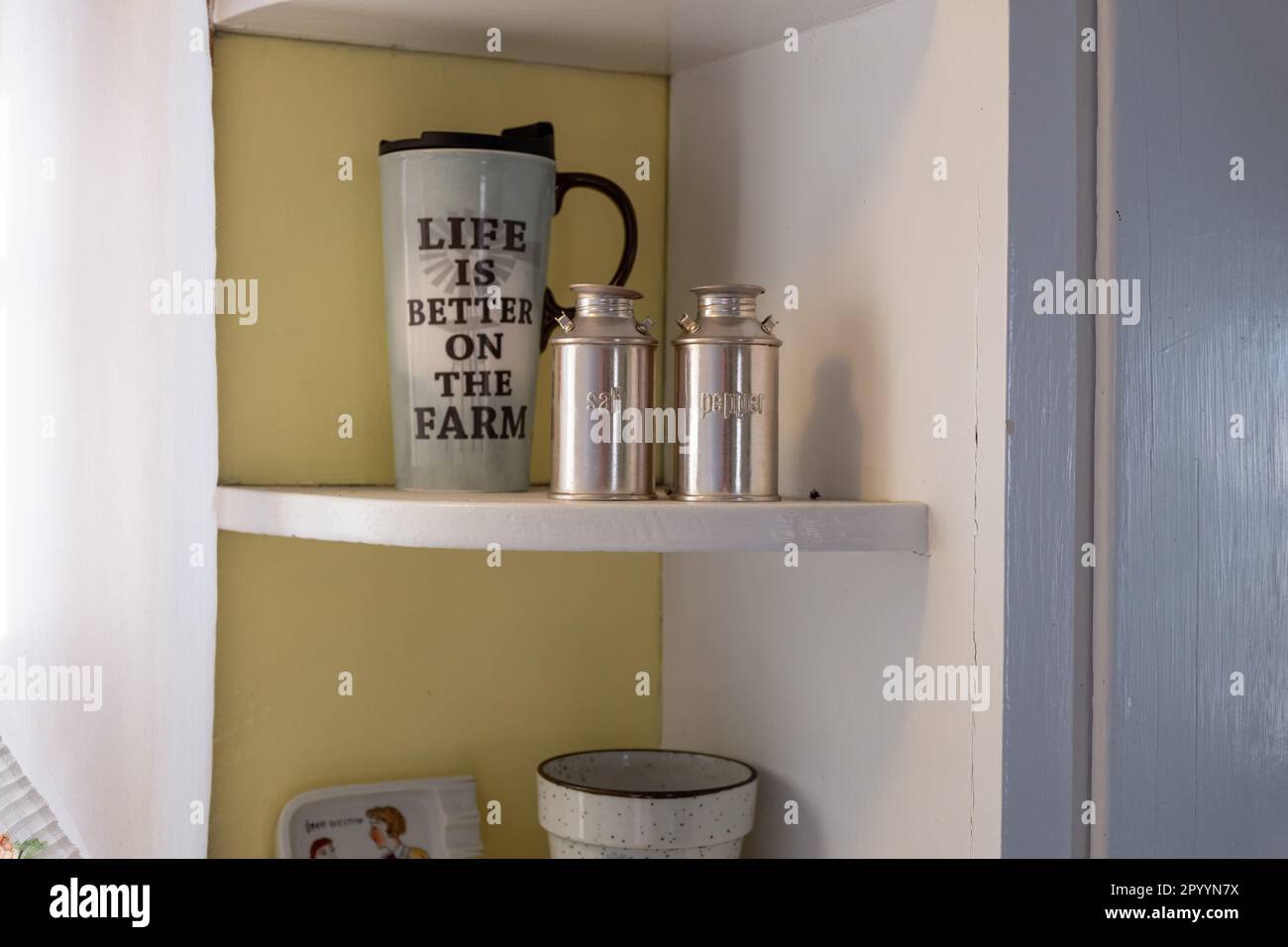 trinkets in old farmhouse proudly on display in kitchen window Stock ...