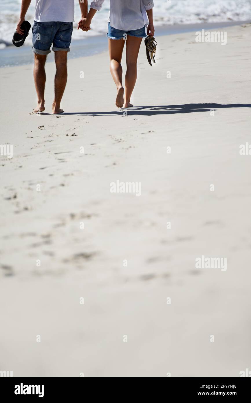 Seaside stroll. Cropped image of a couple walking on the beach Stock ...