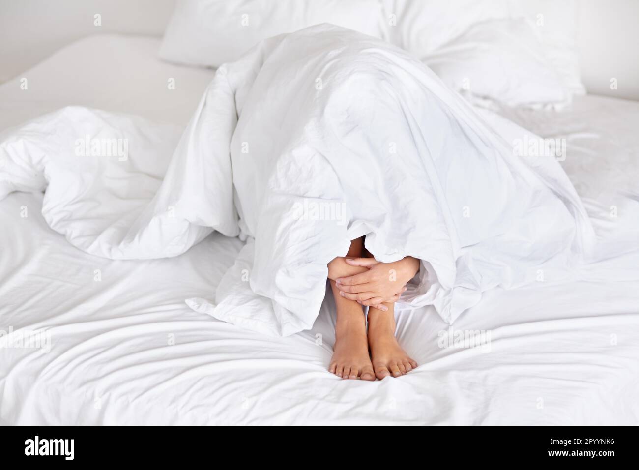 Woman ashamed of her feet hi-res stock photography and images - Alamy