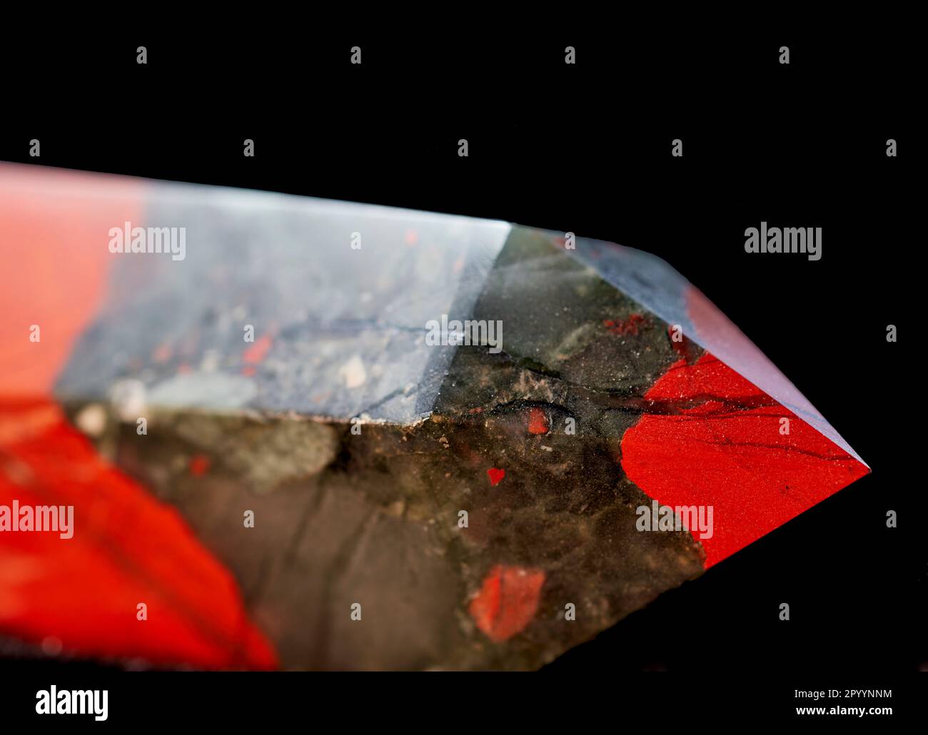 Close up of a Bloodstone Jasper mineral specimen cut into an Oblelisk ...