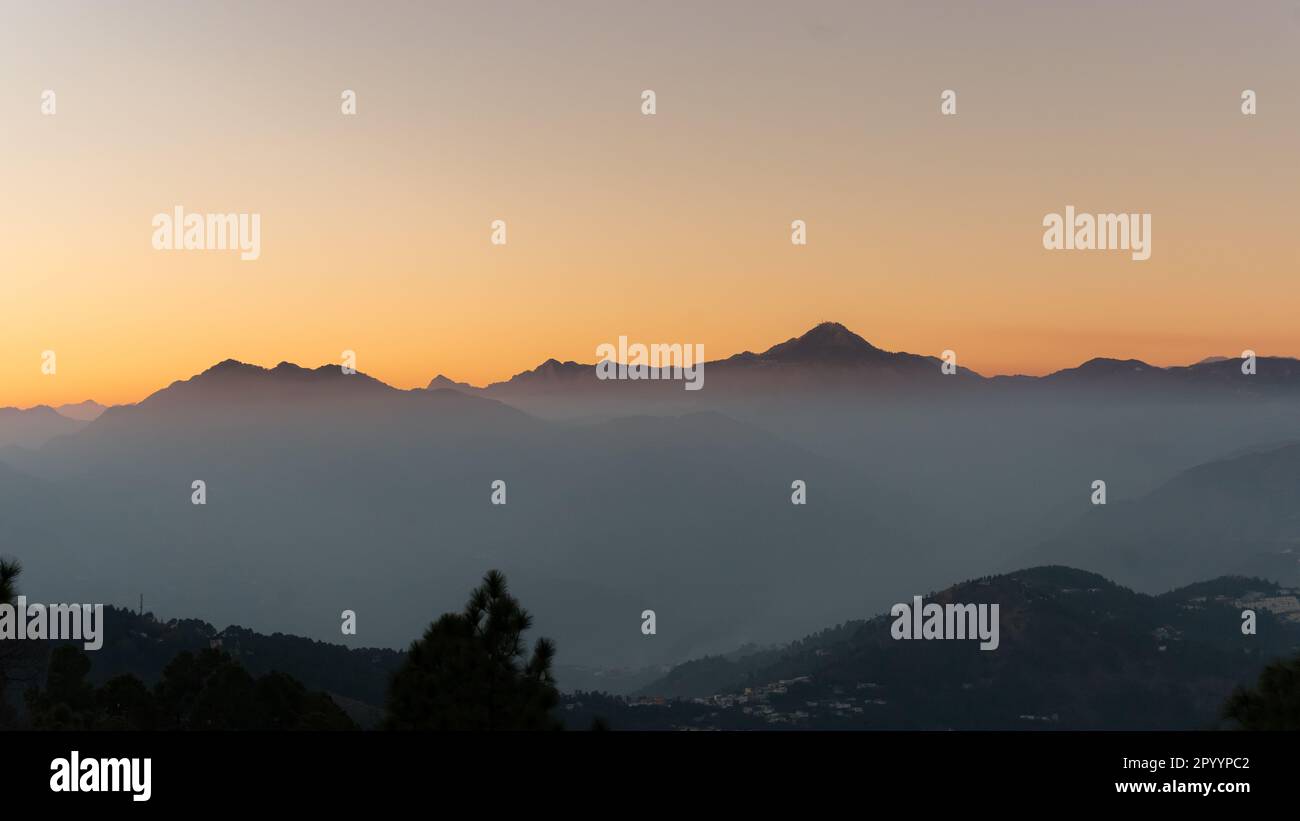A beautiful winter sunset in the Garhwal Region of India, with the ...