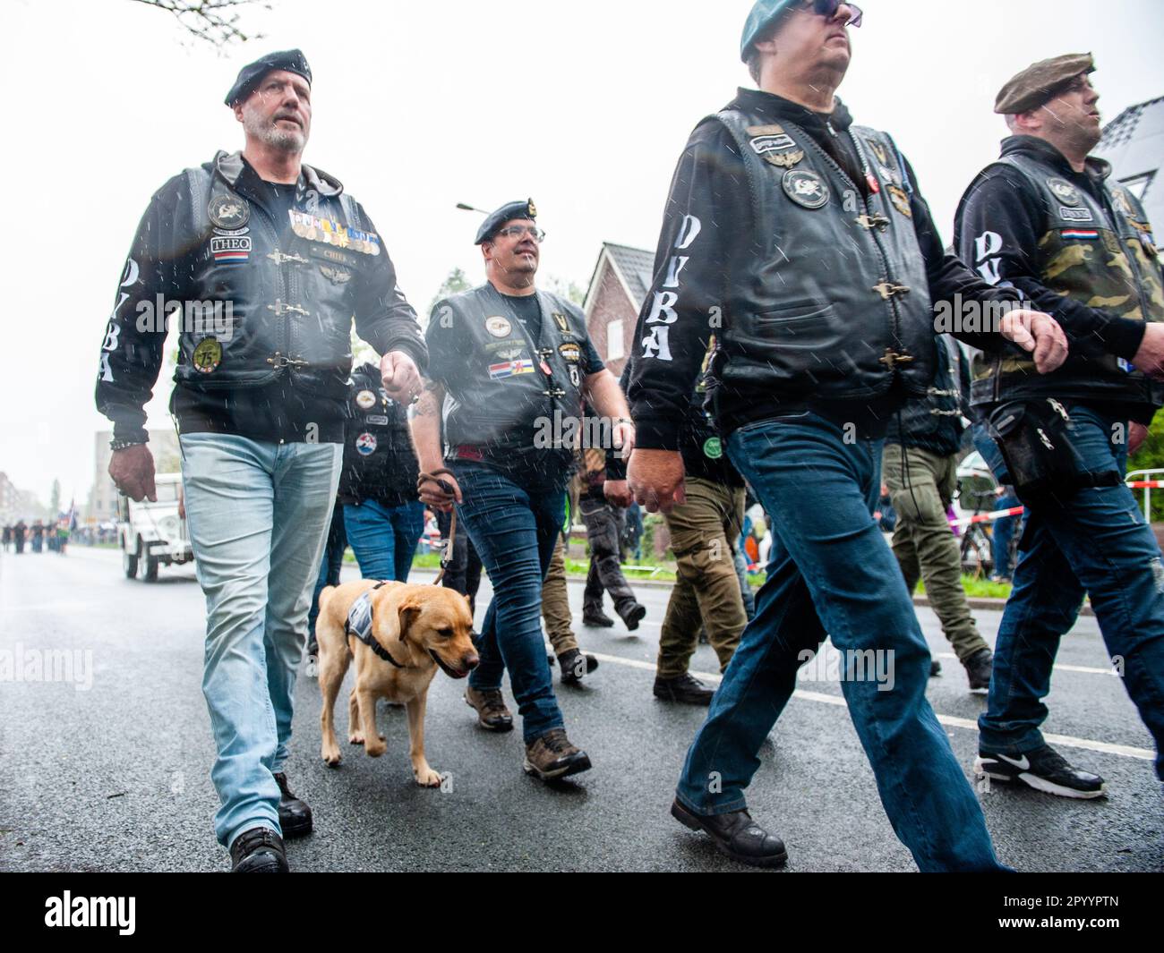Members of the Dutch Veterans Bikers Association are seen walking ...