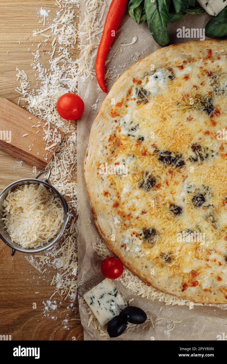 italian four cheeses pizza. Pizza on rustic wooden background with ...