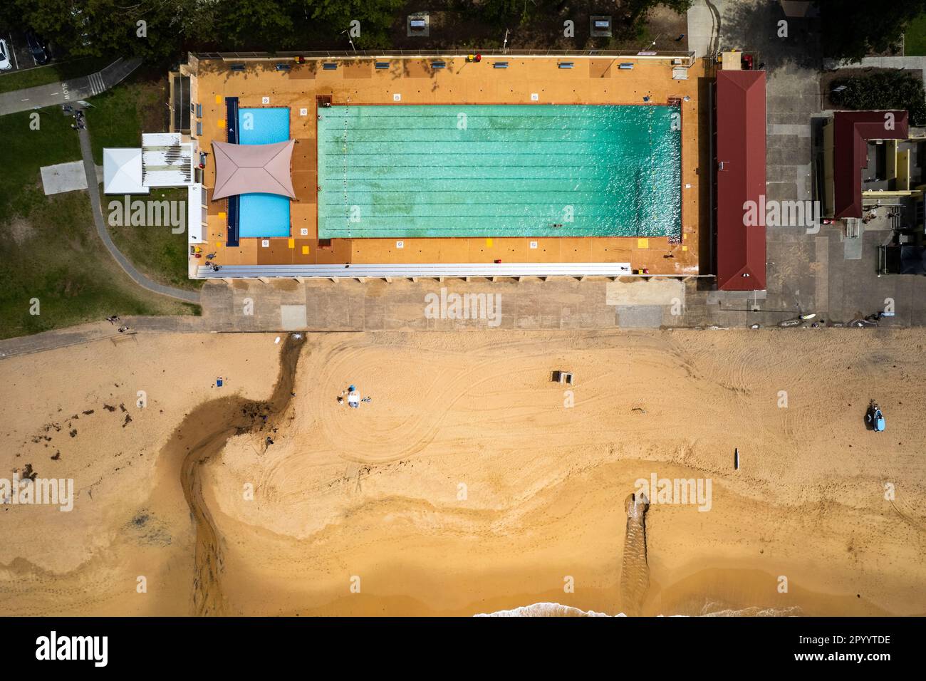 Aerial view of a picturesque swimming pool located at Thirroul Beach in ...