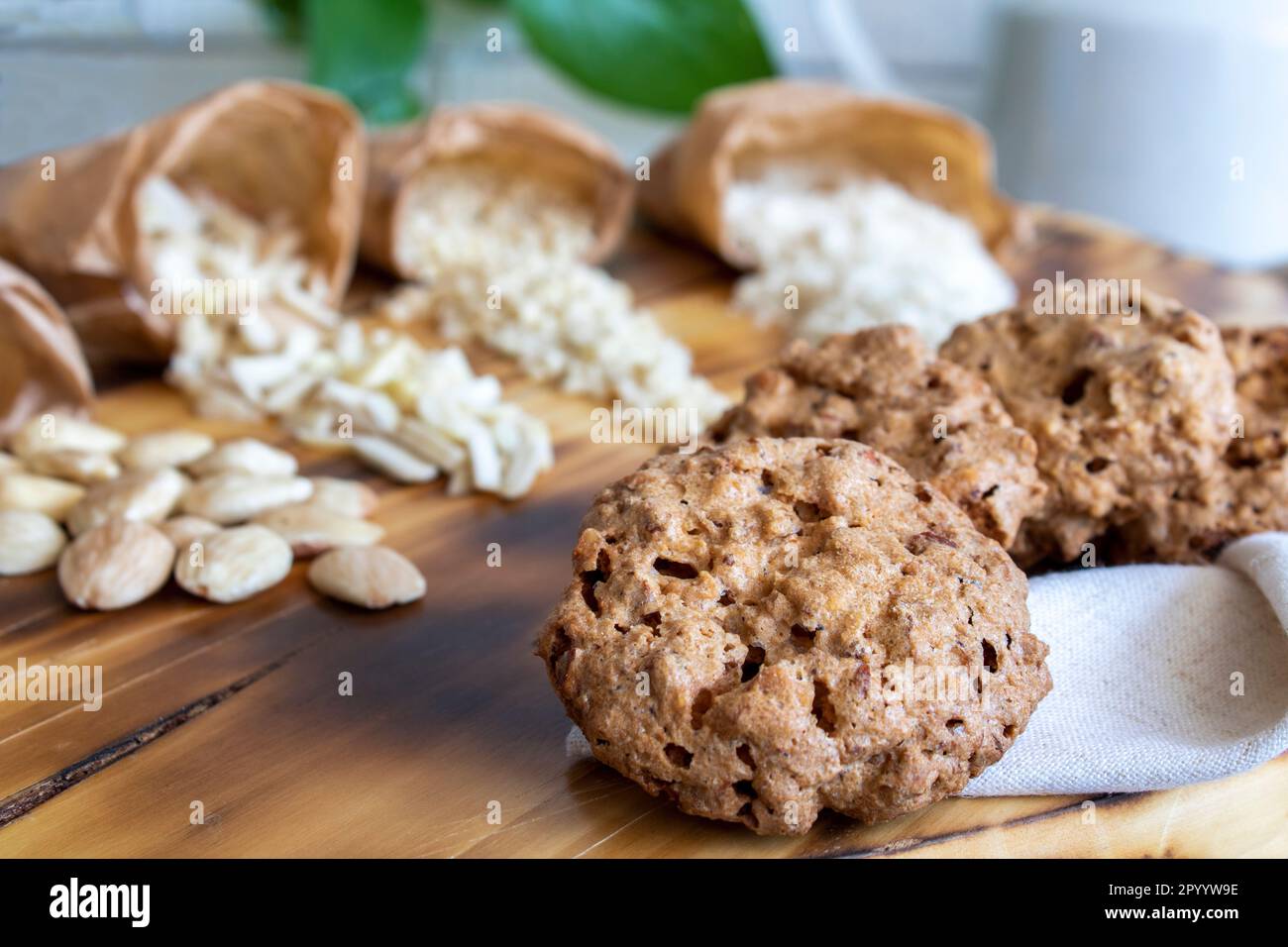 Craft paper packets with whole raw almonds, cut and crushed. Almond ...