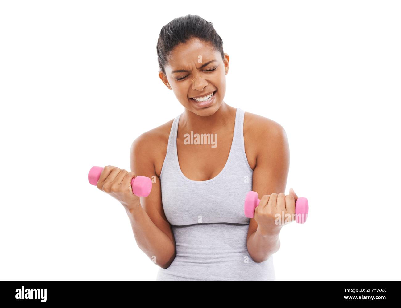 Working her muscles to the extreme. A young woman straining while ...