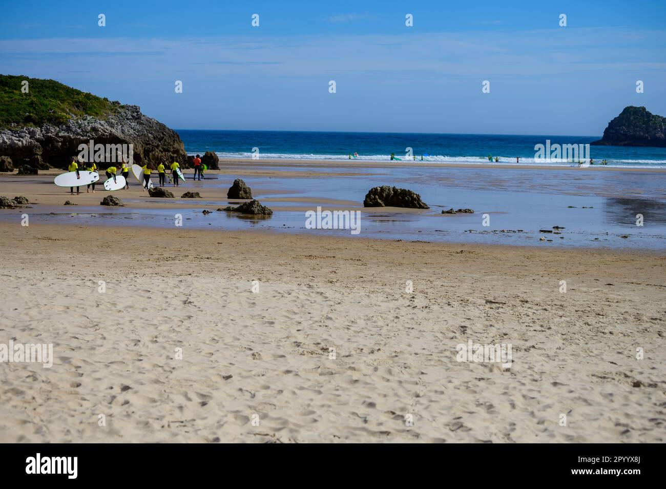 Young surfers train with boards on Playa de Palombina Las Camaras in ...