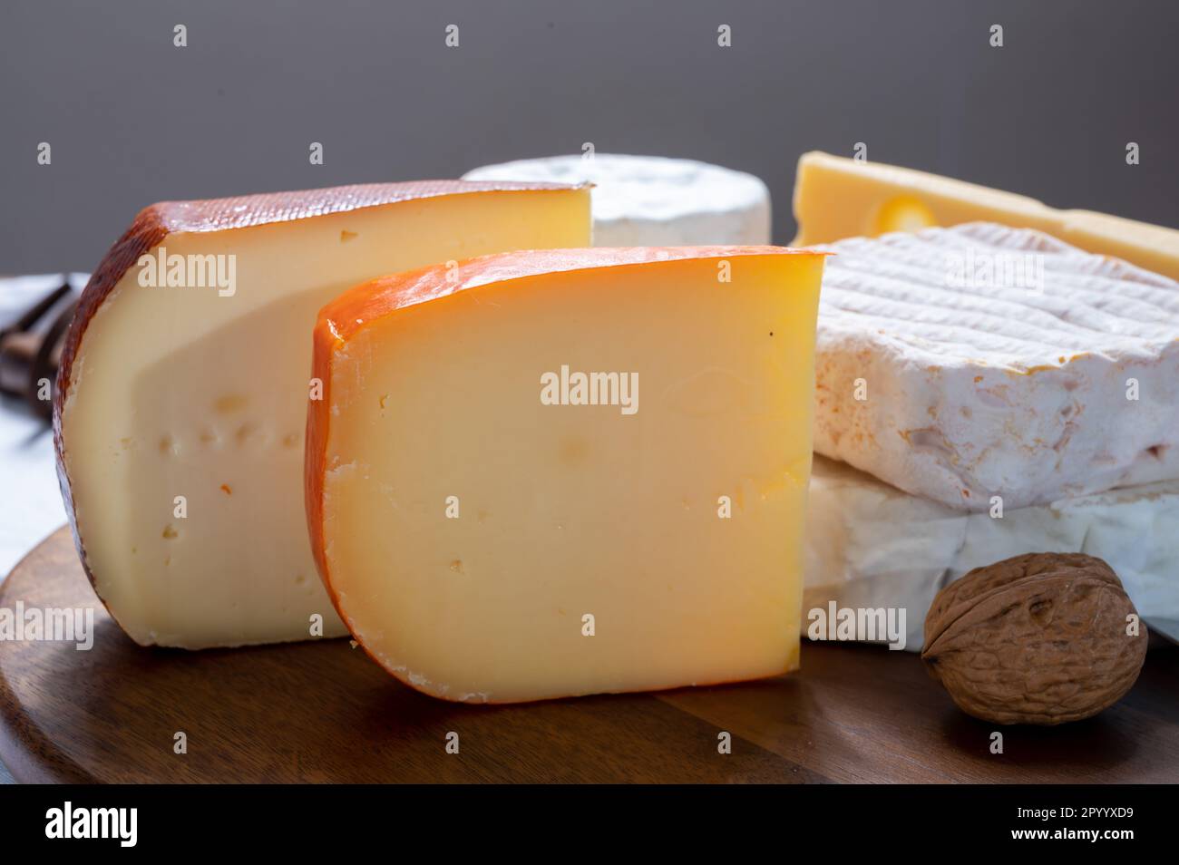 Collection of Belgian cheeses, soft yellow cow milk cheese with white ...