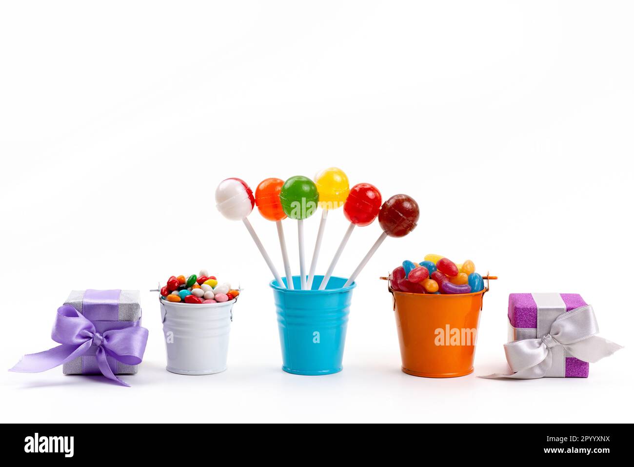 a front view colorful candies with little round lollipops isolated on ...