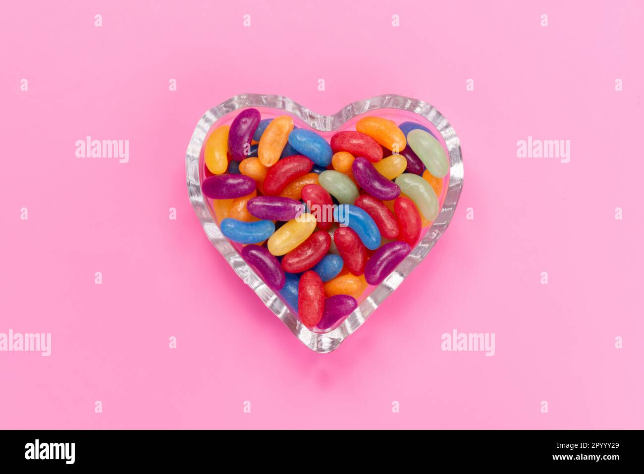 a top view colorful candies marmalades sweets inside glass plate on the ...