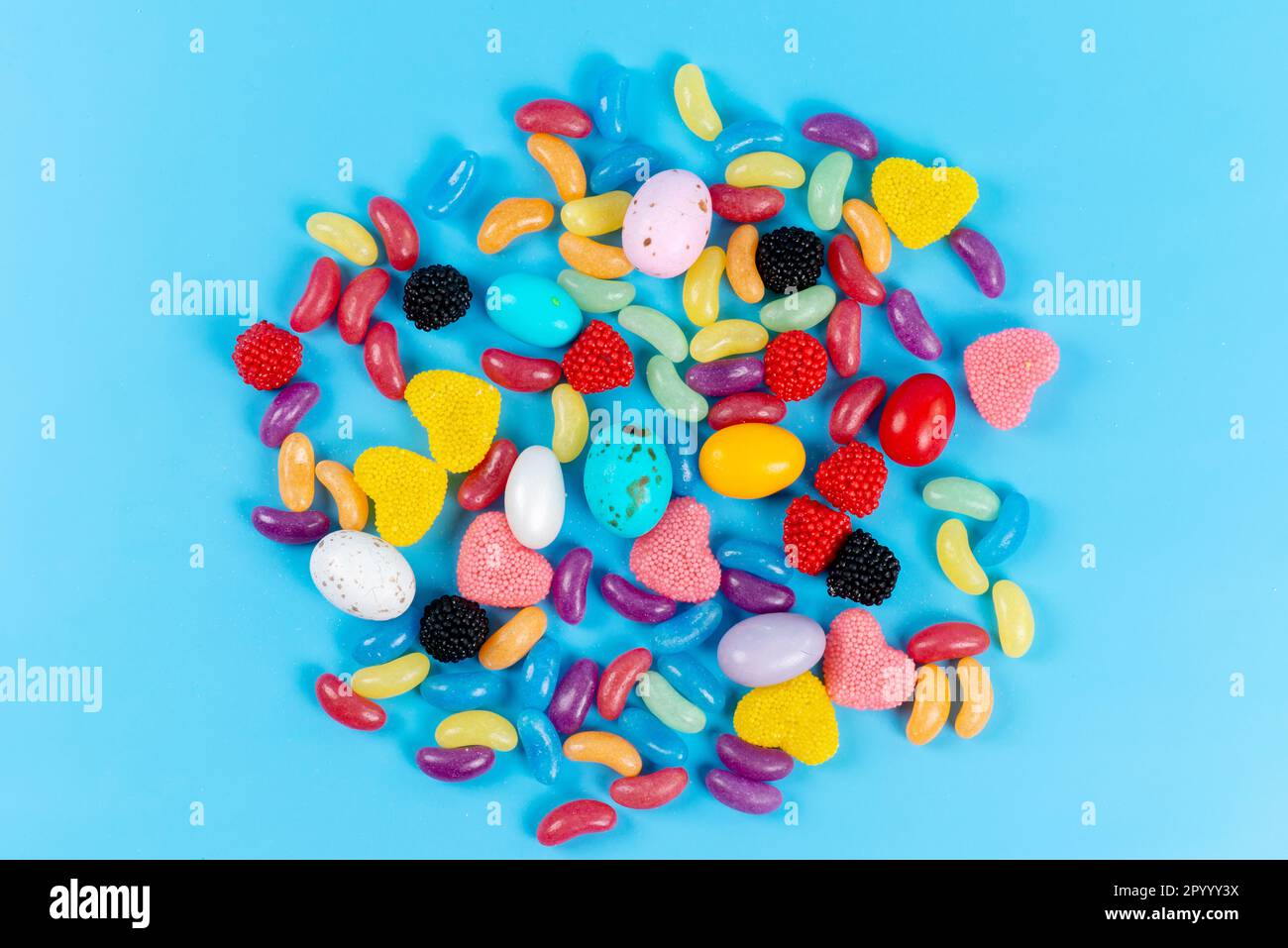 a top view colorful candies sweet and tasty composition on the blue ...