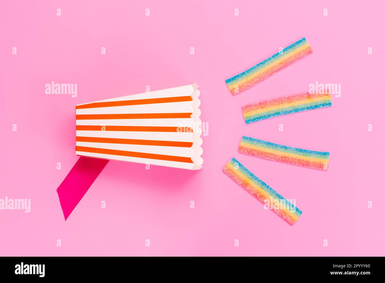 a top view empty popcorn package isolated on the pink desk corn seeds ...