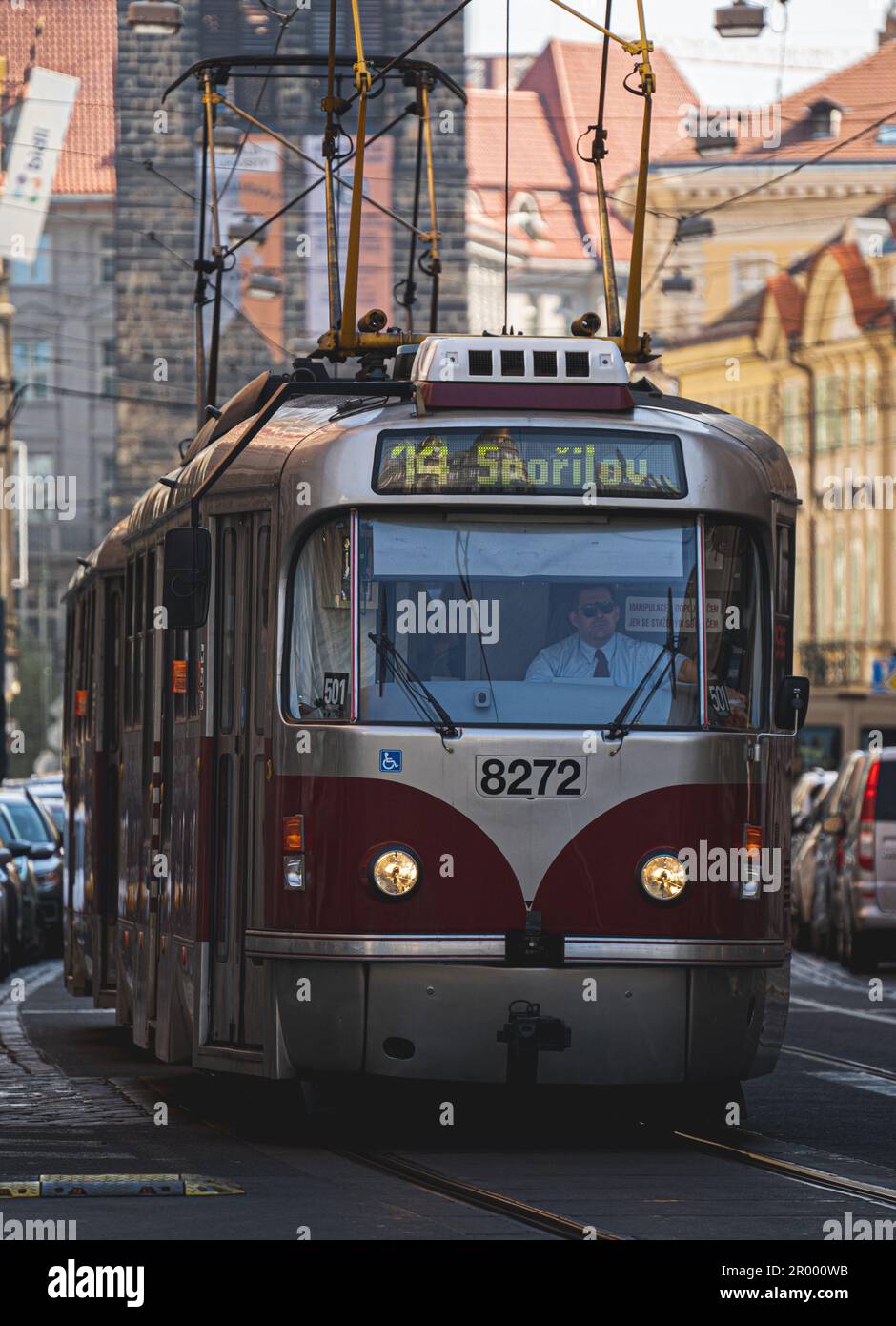 A vintage trolley car is seen in motion, travelling down a track in a ...