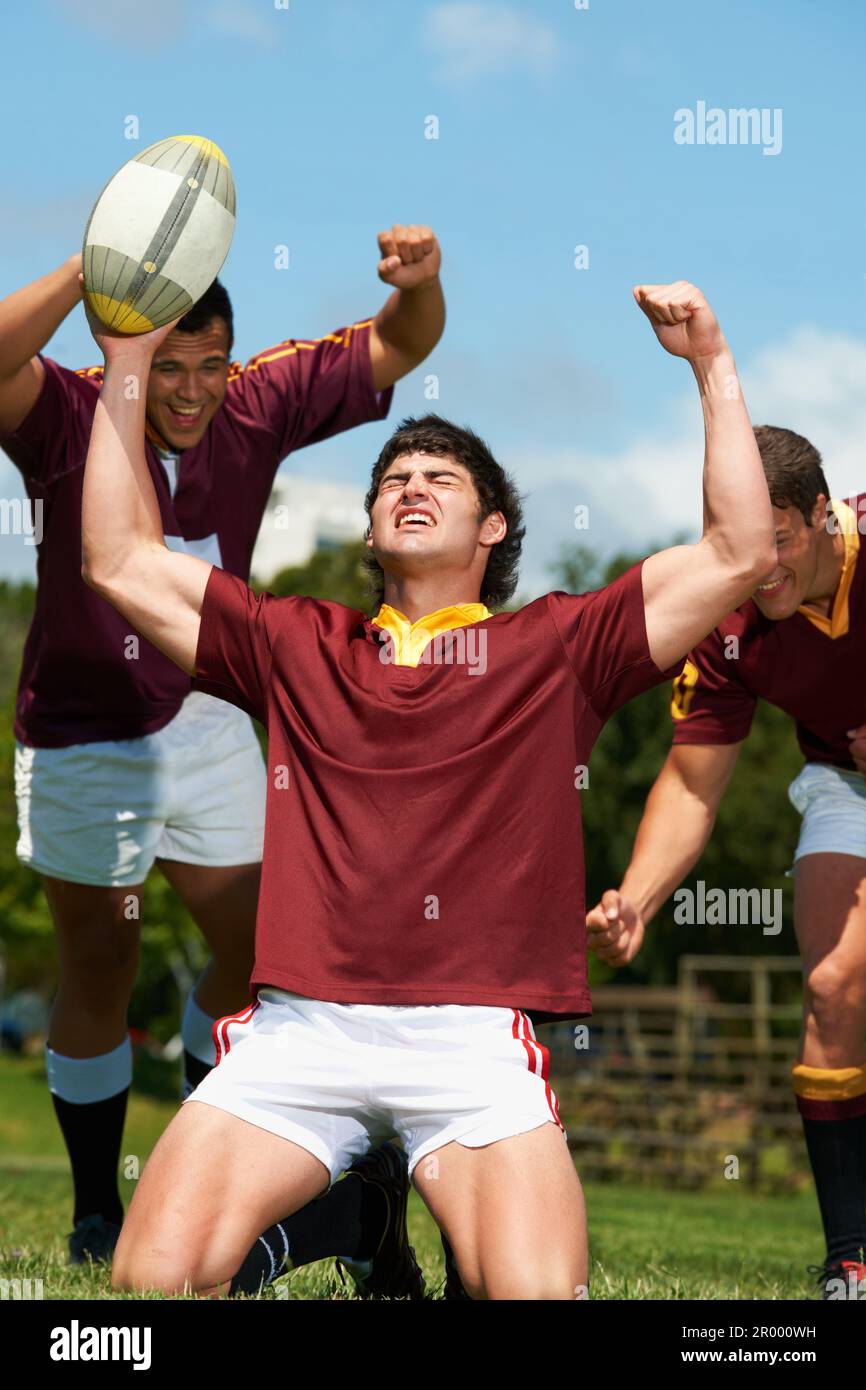 Victory is mine. a young rugby team celebrating a victory Stock Photo ...