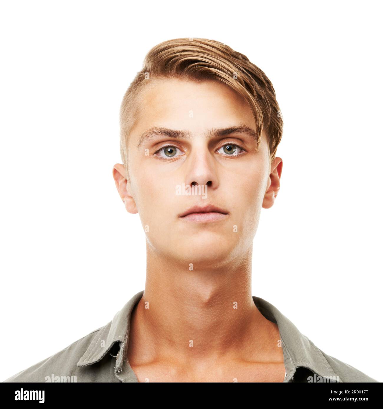 Unreadable expression. Studio headshot of a serious looking young man ...