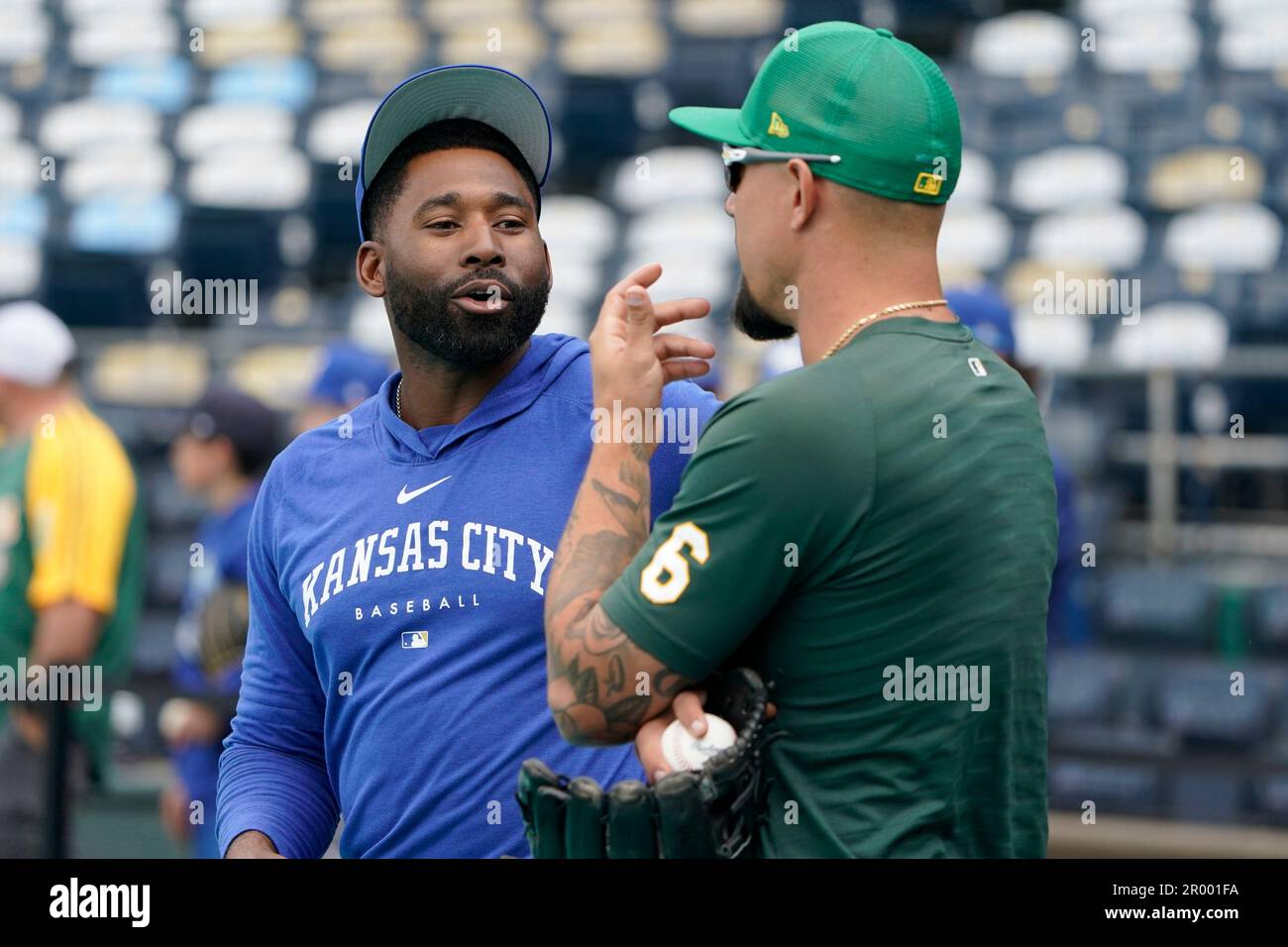 Kansas City Royals' Jackie Bradley Jr., left, talks with Oakland ...