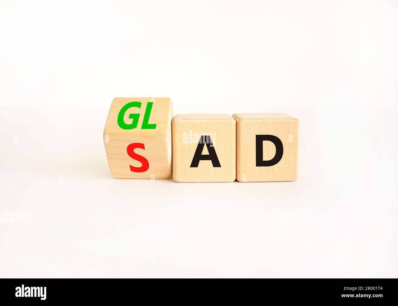 Glad or sad symbol. Businessman turns wooden cubes and changes the word ...