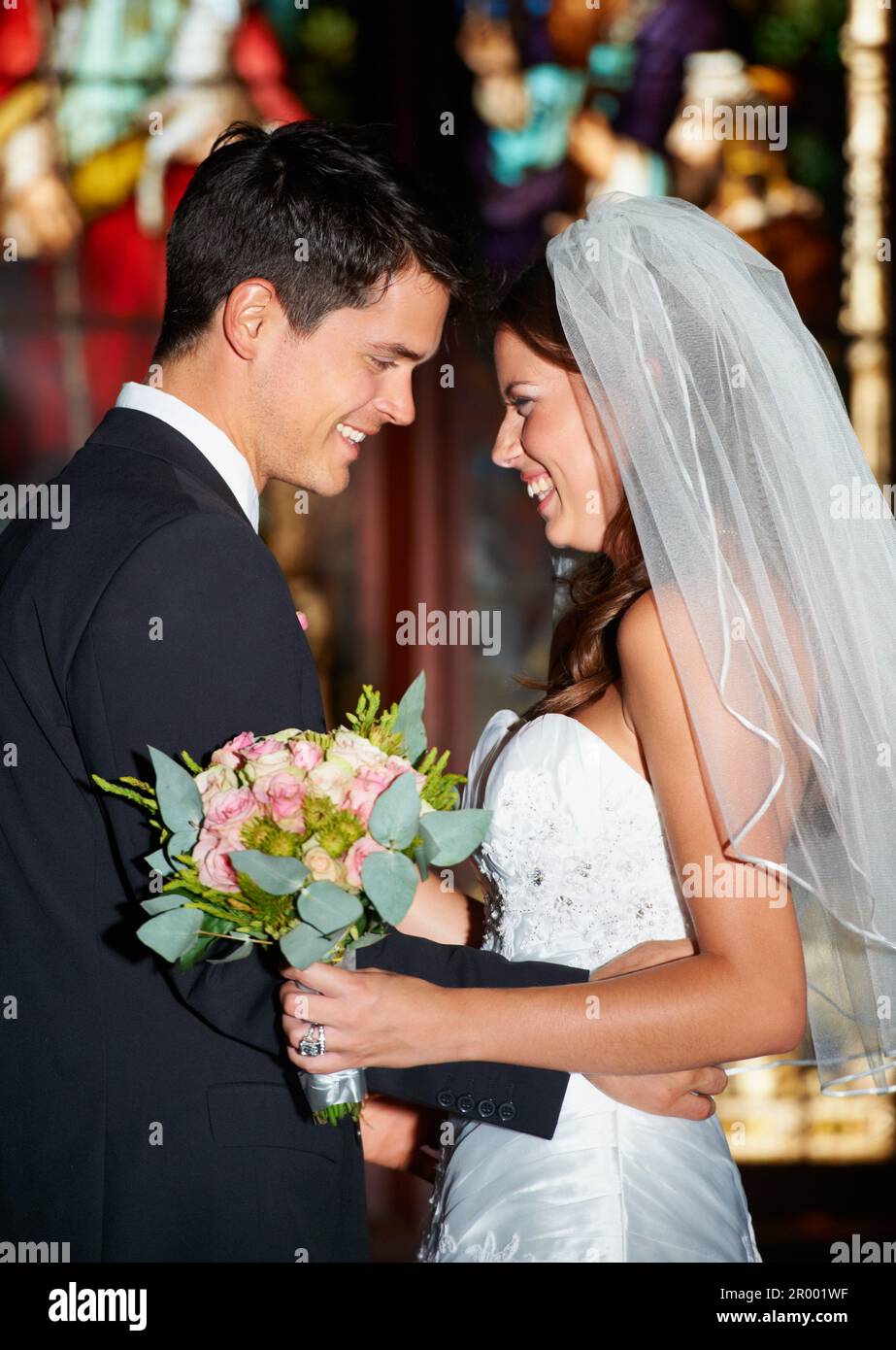 Laughter to last a lifetime. a happy newlywed couple hugging each other ...