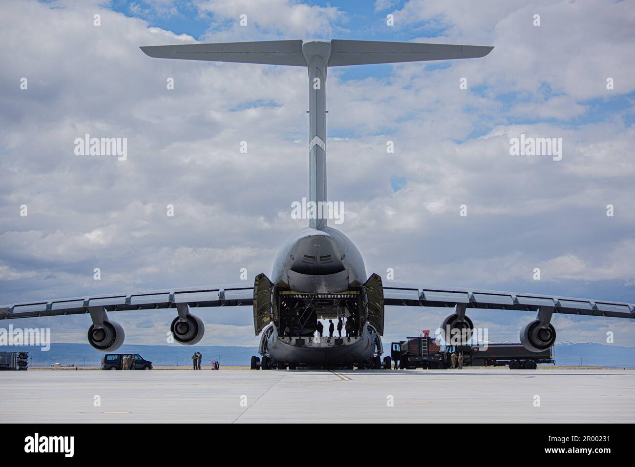 U.S. Air Force Airmen load cargo onto a C-5 Galaxy, assigned to Travis ...