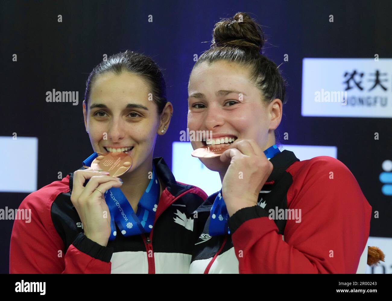 Canada's Pamela Ware, left, and Mia Vallee pose with their bronze ...