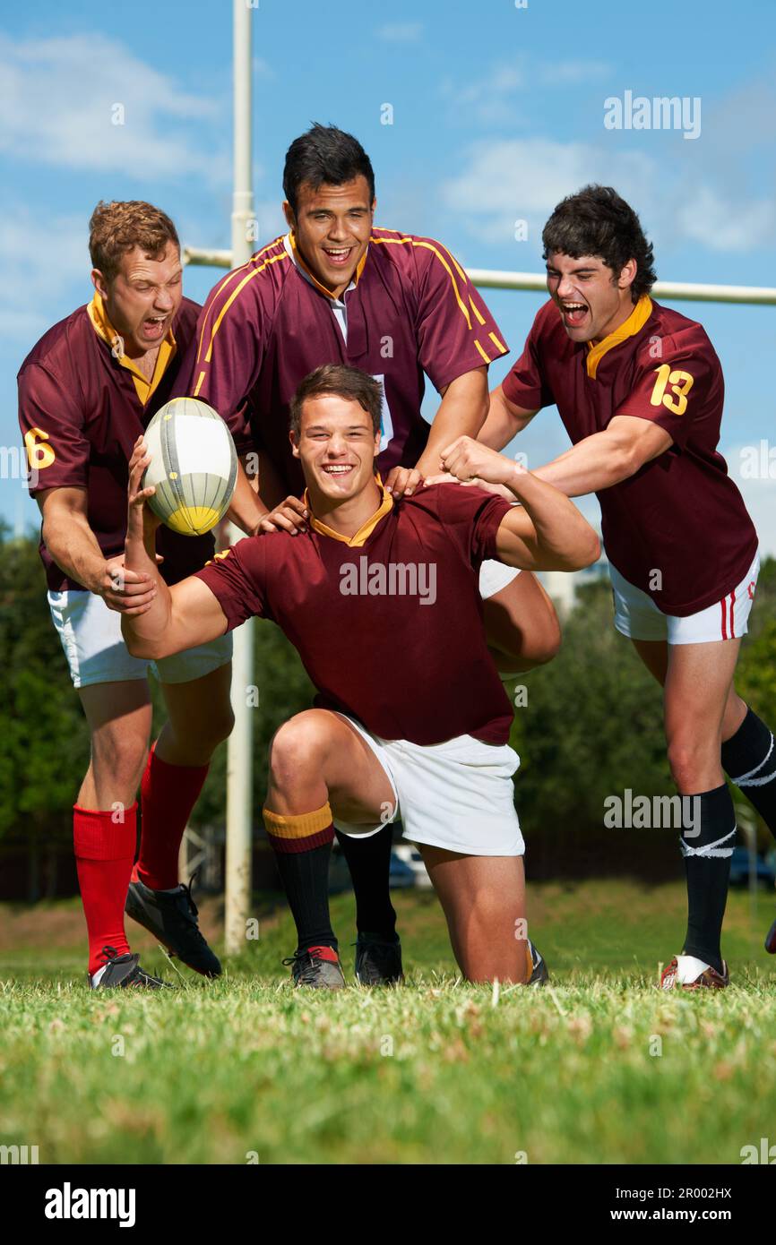 Proud of our sports achievements. Full length portrait of a young rugby ...