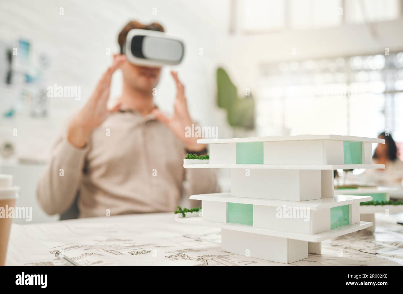 Designer using VR headset to plan his building.Architect playing with ...