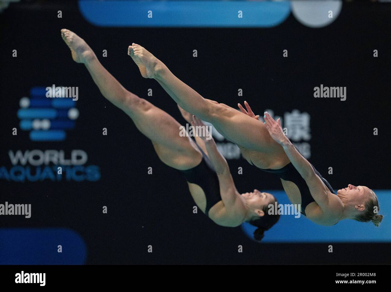 Sarah Bacon and Kassidy Cook, of the United States, compete to a second ...