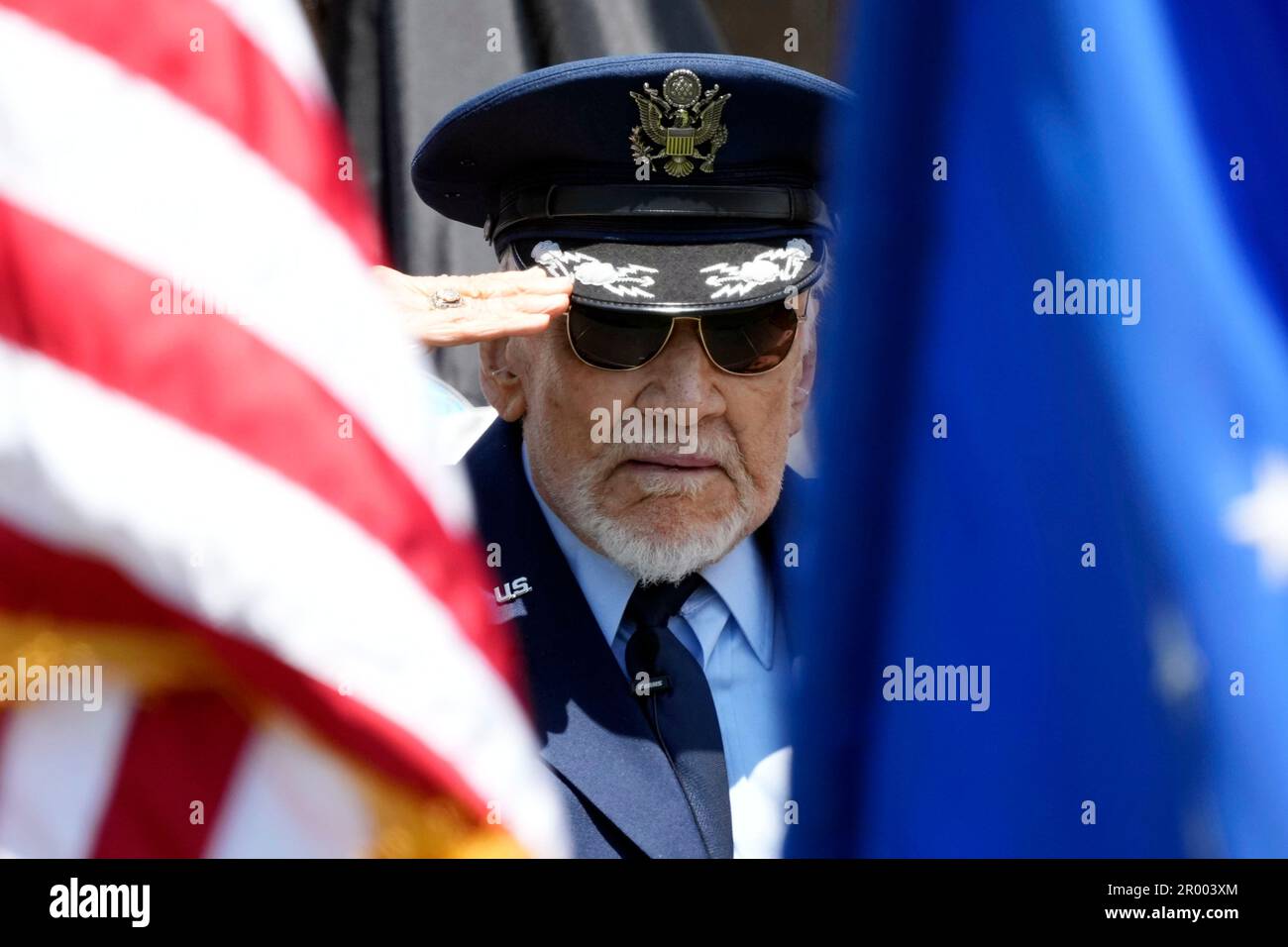 U.S. Air Force Col. Buzz Aldrin, retired, salutes the U.S. flag during ...