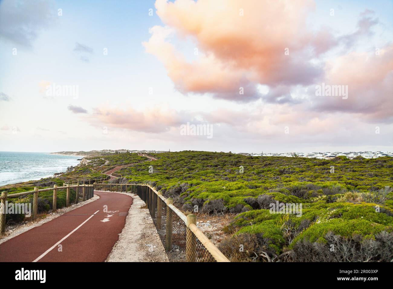 Walking path on the australian coast in the evening with sunset light ...