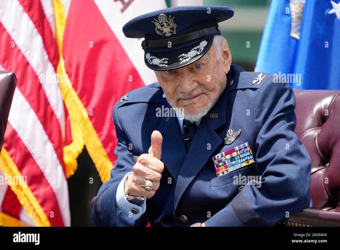 U.S. Air Force Col. Buzz Aldrin, retired, gives a thumbs up to members ...