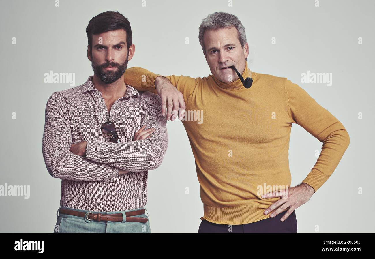 Its a mans world. Studio shot of two men standing together while ...