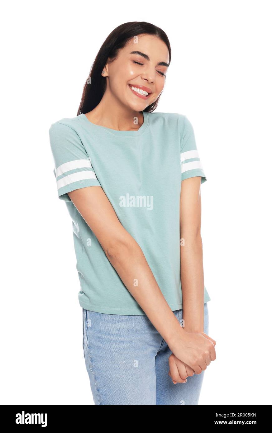 Embarrassed young woman in shirt on white background Stock Photo - Alamy