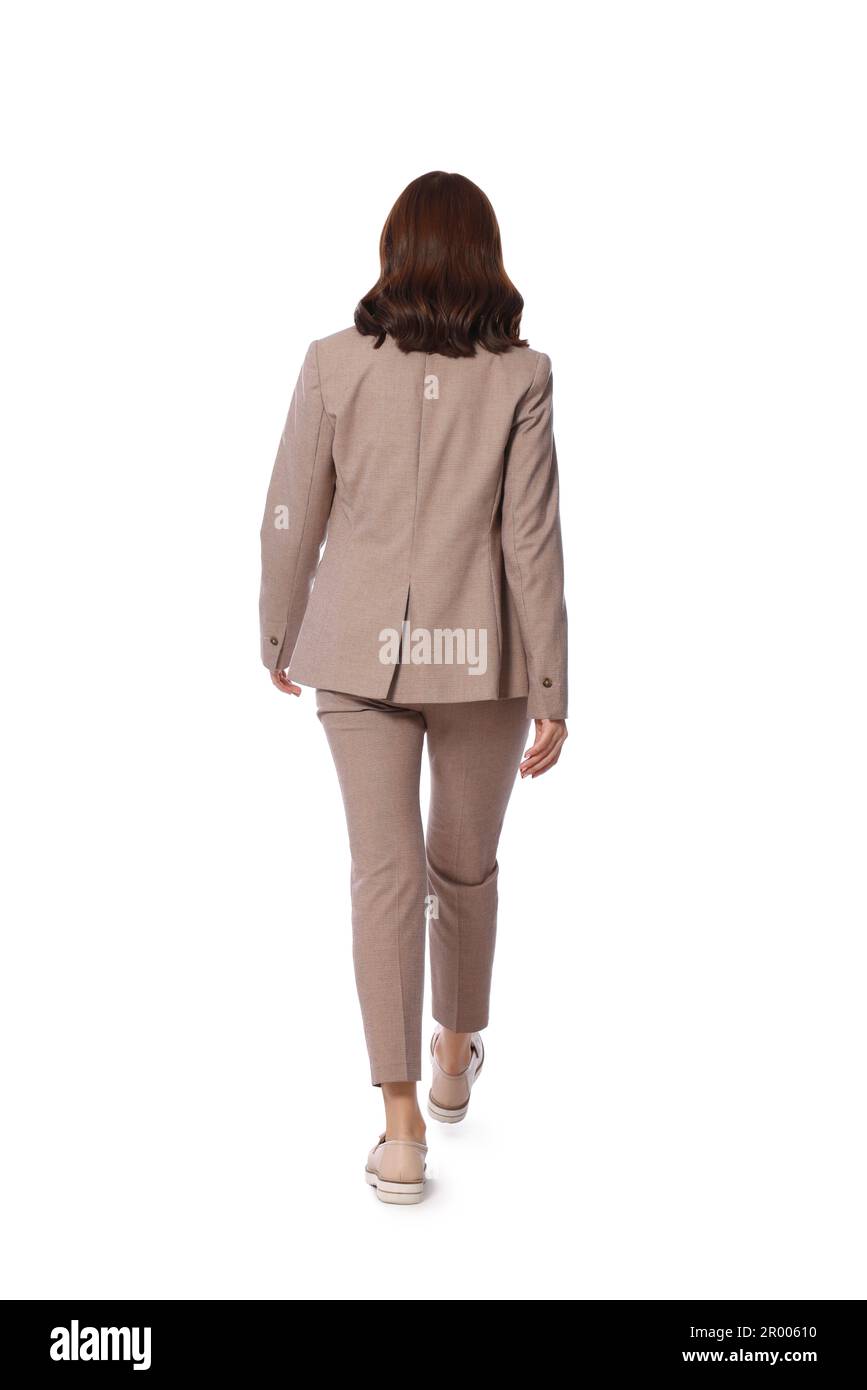 Woman in formal suit walking on white background, back view Stock Photo ...
