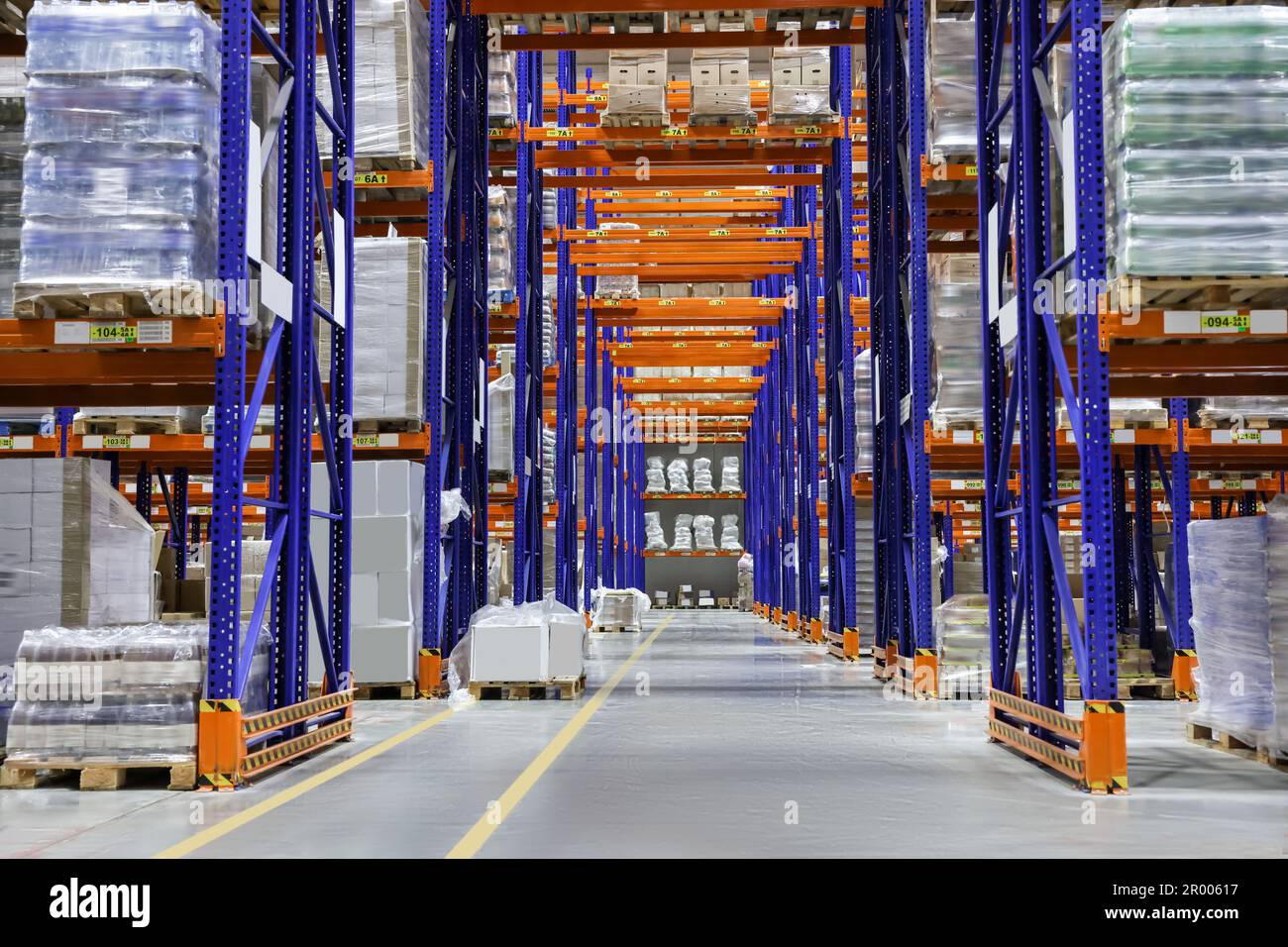 Warehouse interior with metal racks full of merchandise. Wholesale ...