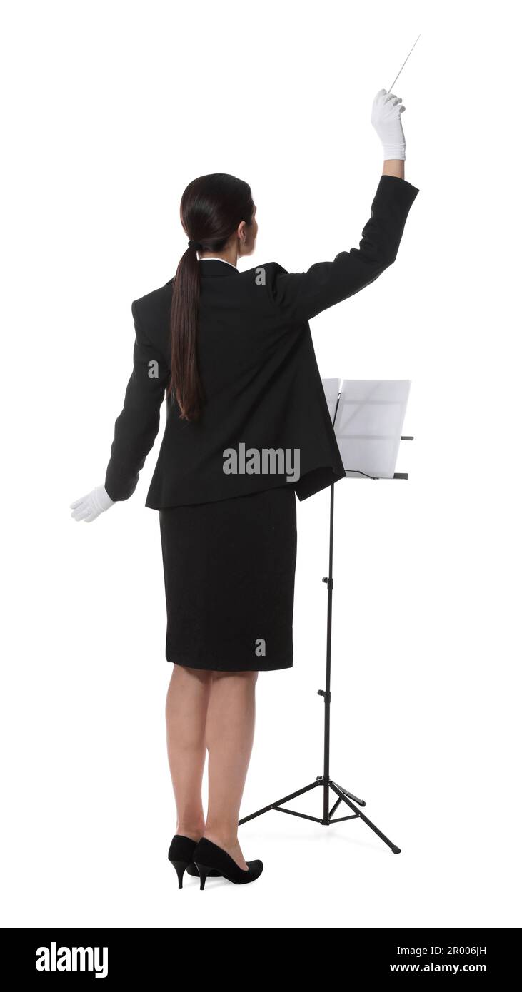 Professional conductor with baton and note stand on white background ...