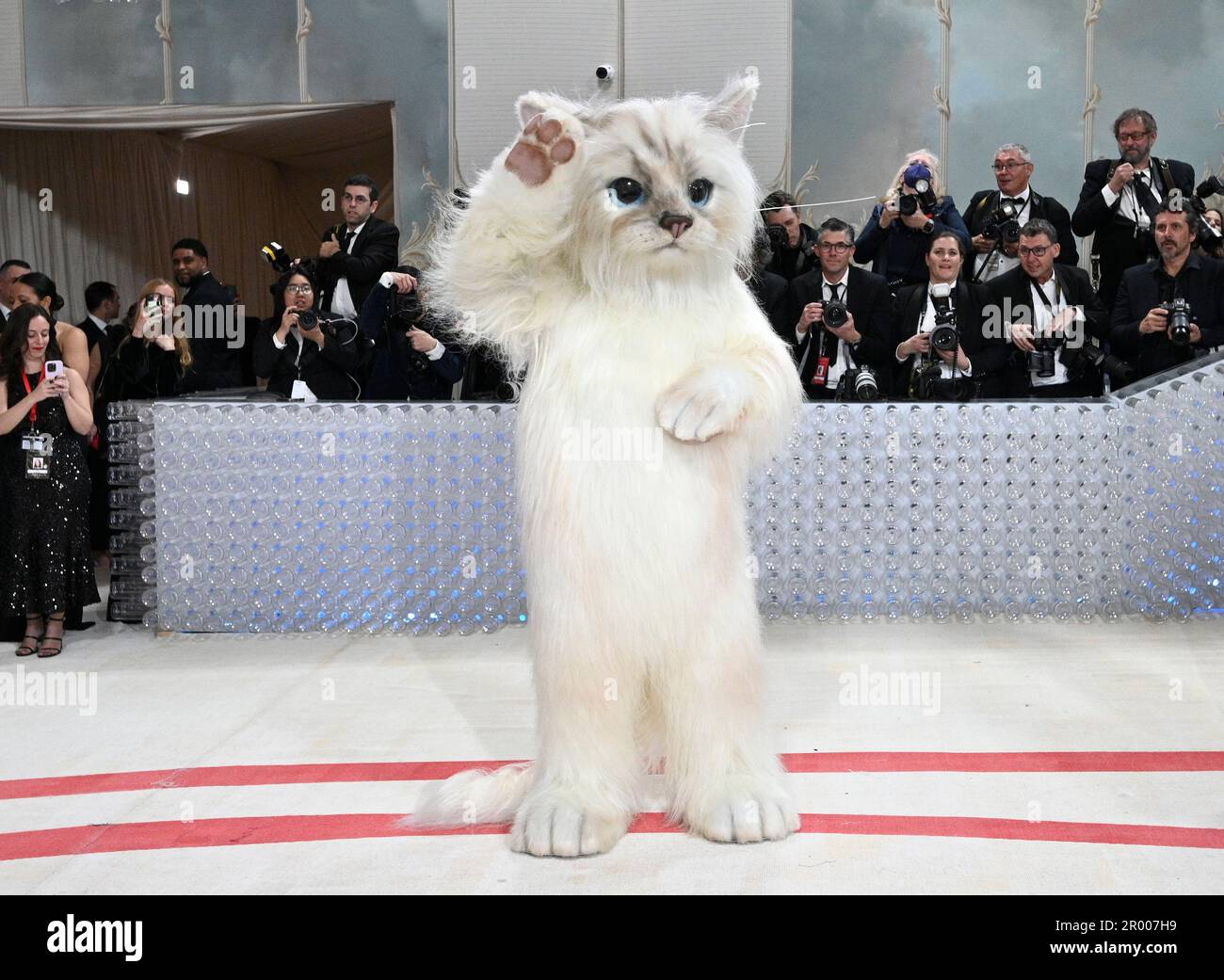 Jared Leto, dressed as Karl Lagerfeld's pet "Choupette," waves as he ...