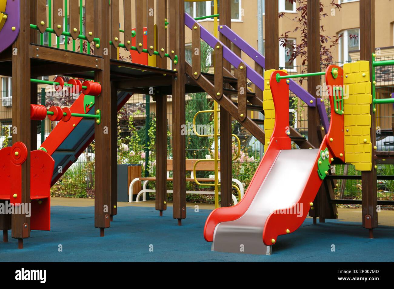 Colourful slide outdoor playground for children in residential area ...