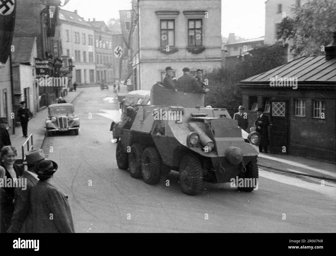 German armored cars driving through a town in the Schatzlar-Freiheit ...