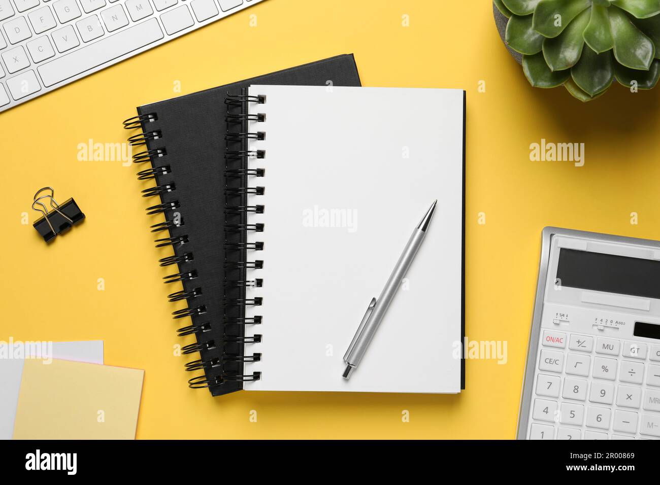 Flat lay composition with stylish notebooks on yellow background Stock ...